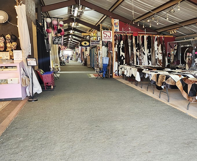 The green-floored corridor of possibility stretches before you, lined with treasures waiting to be discovered. Every vendor stall is its own universe of potential finds.