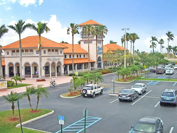 Mediterranean elegance meets retail therapy at Florida Keys Outlet Marketplace, where palm trees stand guard over shopping paradise.