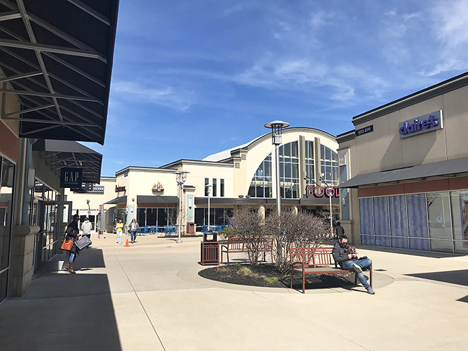The grand entrance to Cincinnati Premium Outlets beckons like a temple of retail therapy, promising treasures within those won't bankrupt your retirement fund.