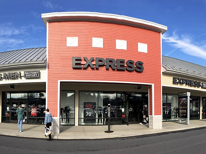 The coral-colored Express storefront beckons like a retail lighthouse, promising fashion treasures at prices that won't make your wallet weep.