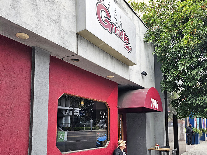 The iconic red awning of The Griddle Cafe beckons hungry Angelenos like a breakfast bat signal. Your pancake destiny awaits behind those doors.
