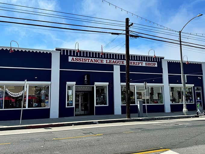 The navy blue fa&ccedil;ade of Assistance League Thrift & Vintage stands proudly on Long Beach Boulevard, a beacon for treasure hunters and bargain enthusiasts alike.