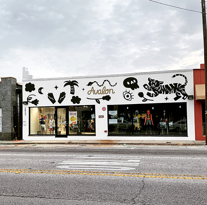 The whimsical storefront of Avalon Exchange beckons with playful palm trees and cosmic symbols, promising a treasure hunt unlike any mall experience.