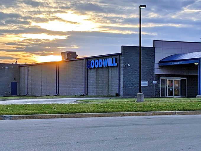 The Goodwill Emporium stands like a blue-signed beacon against the Michigan sky, promising treasure hunters their next great find at sunset. 