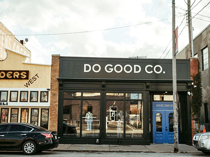 The sleek black storefront of Do Good Co. stands as an inviting portal to sustainable shopping adventures in Kansas City's historic West Bottoms.