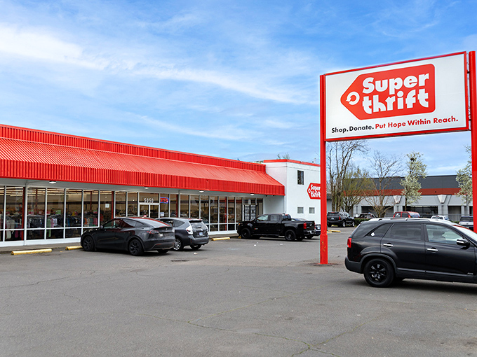 SuperThrift's iconic red roof and signage stand out like a beacon of bargain hope against Portland's sky &ndash; a siren call to thrift enthusiasts everywhere.