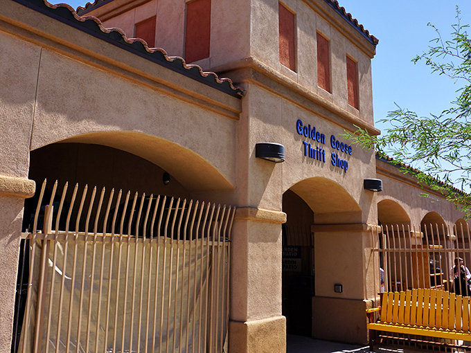 The unassuming exterior of Golden Goose Thrift Shop stands like a treasure chest in the desert, promising bargain-hunting adventures behind its Spanish-style fa&ccedil;ade.