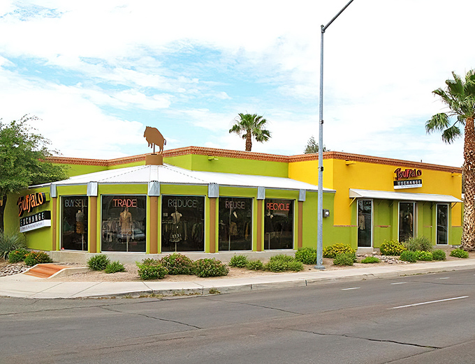 The iconic yellow exterior of Buffalo Exchange in Tucson pops against the Arizona sky like a fashion oasis, complete with that signature buffalo silhouette standing guard.