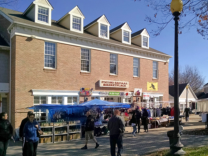 The brick facade of Pocono Bazaar welcomes treasure hunters with dormered windows and the promise of discoveries waiting just beyond those doors.
