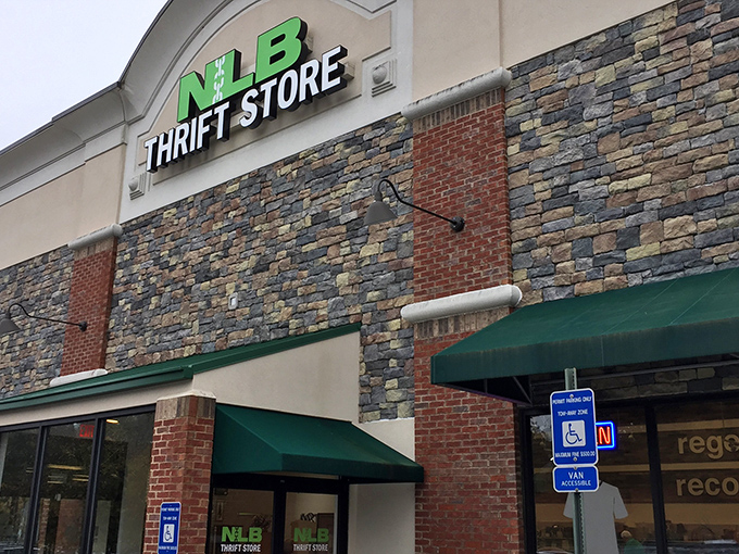 The stone facade and bright green signage of NLB Thrift Store beckons like a siren song to bargain hunters cruising through Woodstock.