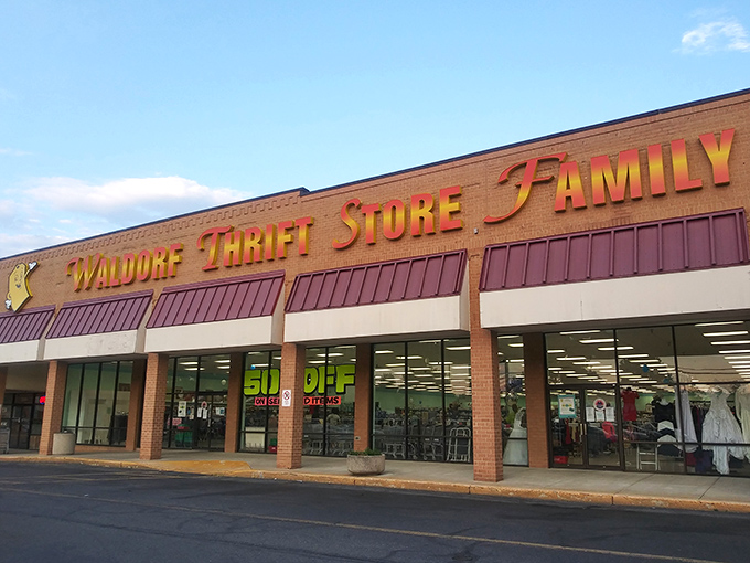 The unassuming storefront of Waldorf Thrift Store Family beckons with its cheerful yellow sign, promising treasures within that big-box retailers can only dream about.