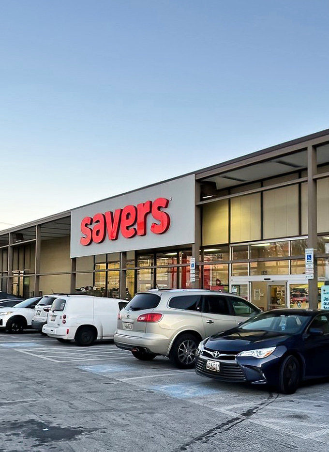 The iconic red Savers sign beckons bargain hunters like a retail lighthouse guiding ships to treasure-filled shores.