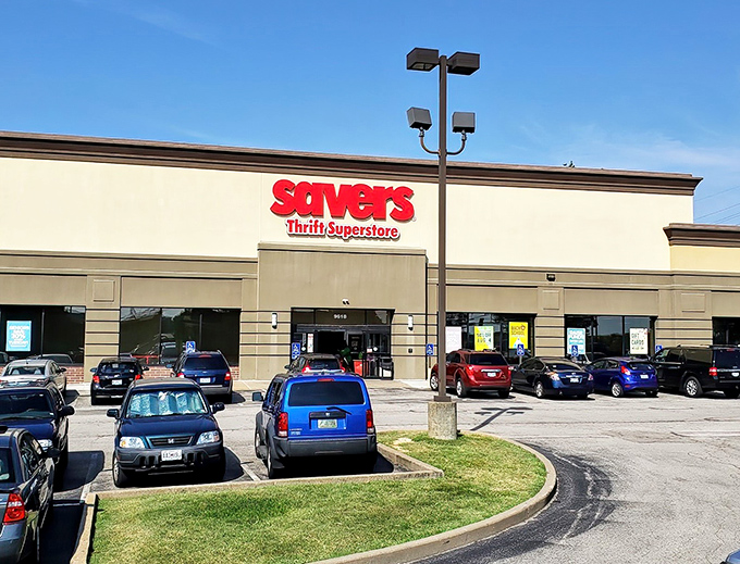 The iconic red Savers sign beckons like a lighthouse for bargain hunters. Your treasure hunt begins the moment you pull into this suburban shopping center.