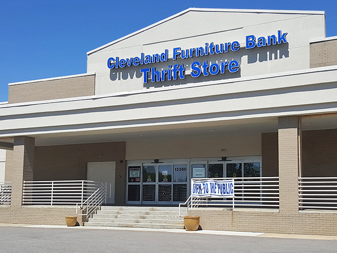 The blue sign beckons like a lighthouse to bargain hunters &ndash; Cleveland Furniture Bank Thrift Store, where wallet-friendly treasures await.