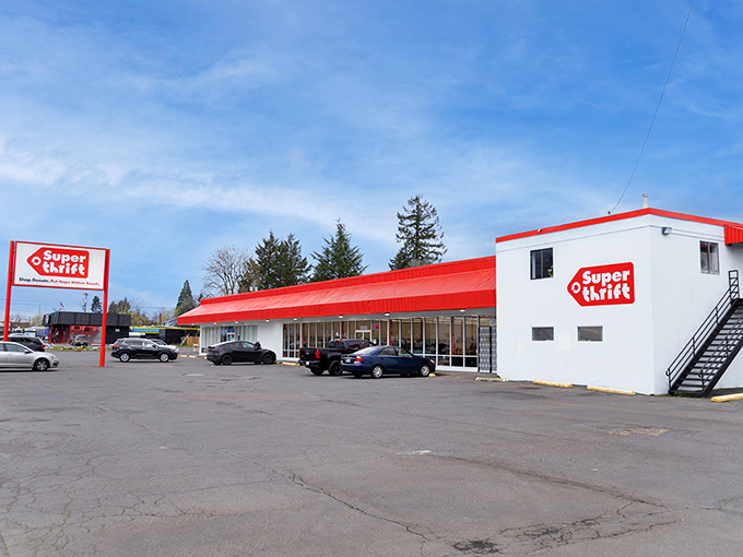 SuperThrift's distinctive red-roofed building stands like a beacon of bargain possibilities under Portland's characteristically optimistic blue sky.