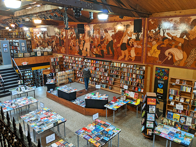 The iconic Midtown Scholar storefront glows like a literary lighthouse in Harrisburg's evening hours, beckoning bibliophiles with promises of endless discovery.