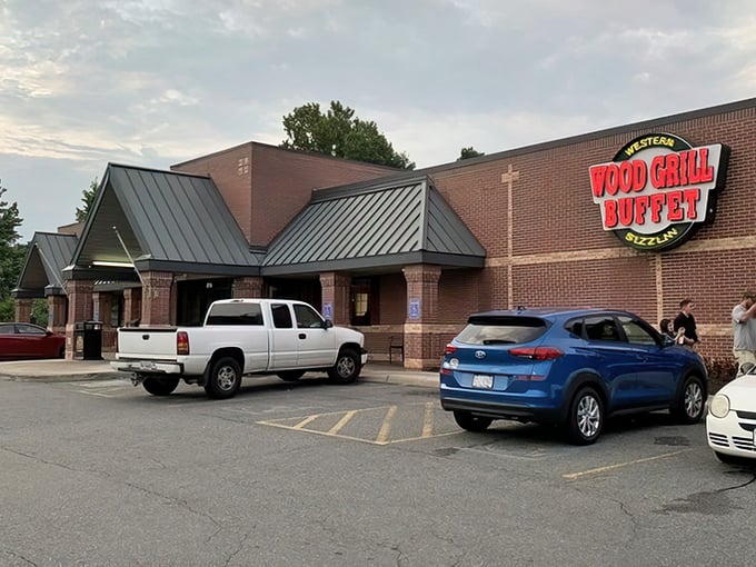 The brick-and-green-roof charm of Wood Grill Buffet stands ready to welcome hungry Virginians like a culinary lighthouse guiding famished travelers home.