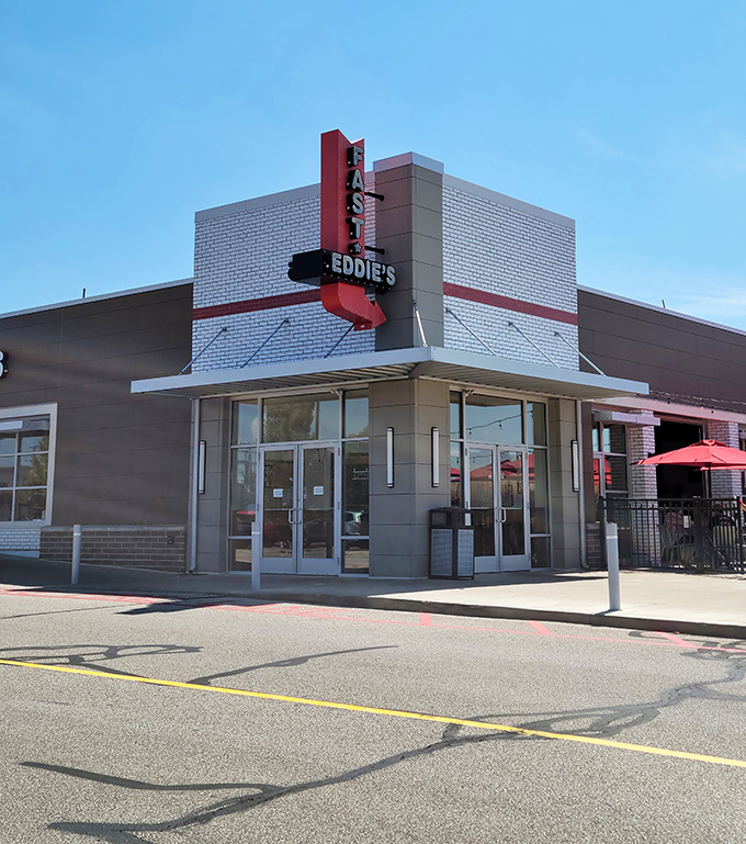 The bold red signage of Fast Eddie's stands out against the modern brick exterior, beckoning hungry travelers like a culinary lighthouse in Parma.
