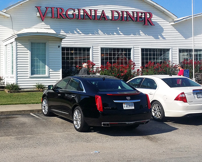The iconic white clapboard exterior with bold red lettering promises Southern comfort before you even step inside. A roadside beacon of deliciousness.
