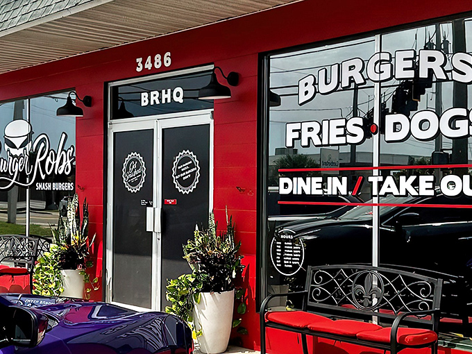 The bright red exterior of BurgerRobs beckons like a burger lighthouse, complete with a welcoming bench for those who can't wait to dig in.