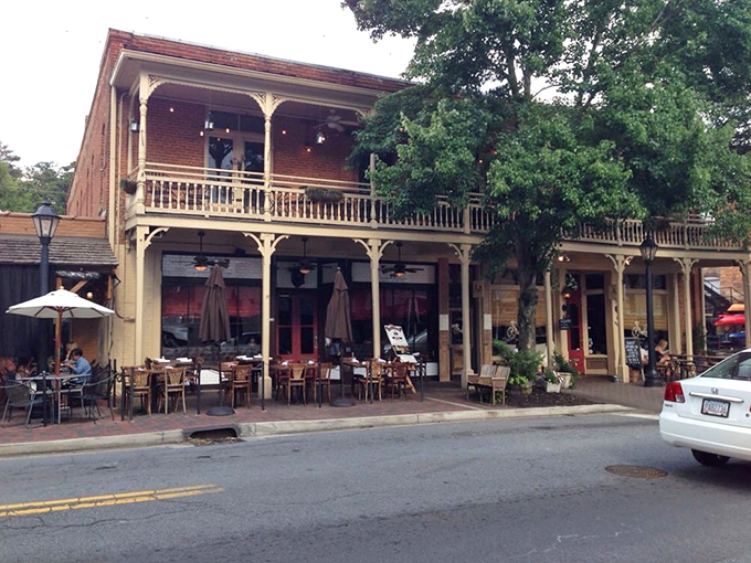 Historic charm meets culinary excellence on Canton Street. Little Alley Steakhouse's beautiful brick exterior and inviting porch beckon meat lovers to step inside and indulge.