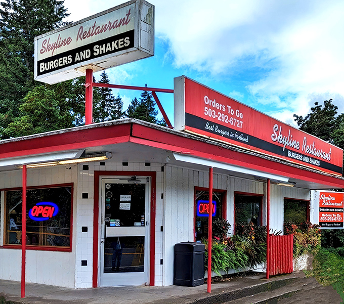 The unassuming exterior of Skyline Restaurant stands like a time capsule among Portland's towering firs, promising burger bliss since 1935.