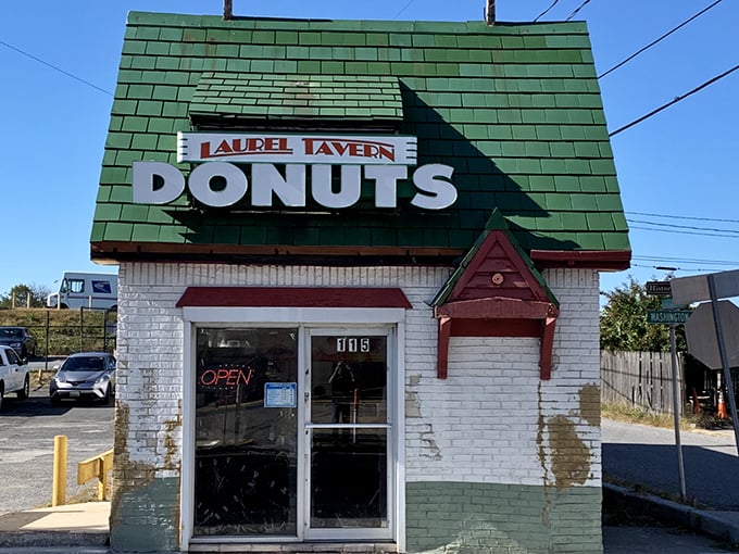 The little donut shop with the big green roof stands like a beacon of sweetness on Washington Boulevard, promising morning salvation one glazed ring at a time.