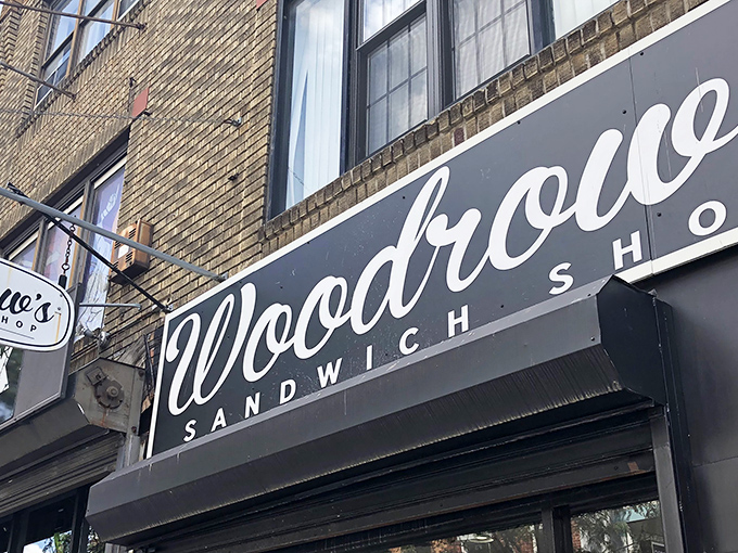 The sleek black and white signage of Woodrow's beckons sandwich pilgrims like a culinary lighthouse on South Street's bustling shores.