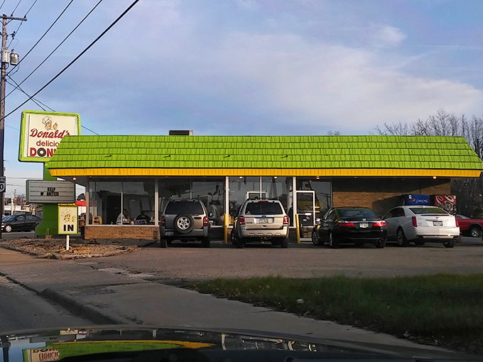 The iconic lime-green roof of Donald's Donuts stands as a beacon of hope for the sugar-deprived masses of Zanesville. Sweet salvation awaits within.