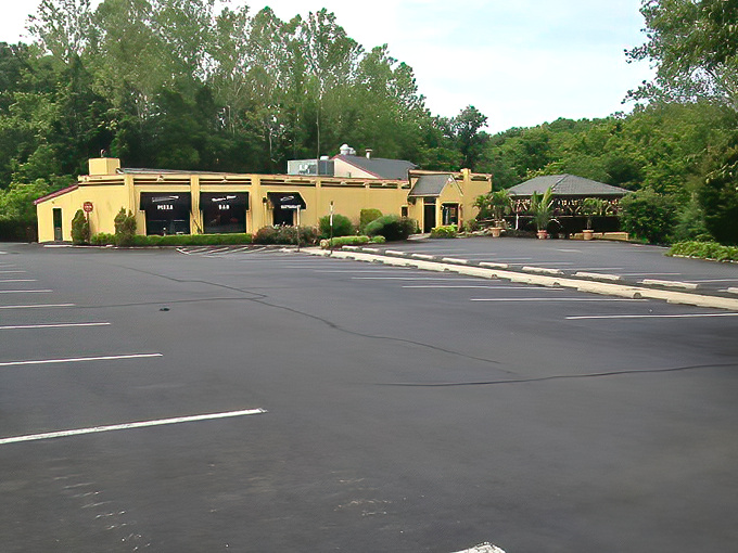 Rustic wooden beams meet stone accents in this dining room that somehow manages to feel both spacious and cozy&mdash;like your favorite sweater got turned into a restaurant. 