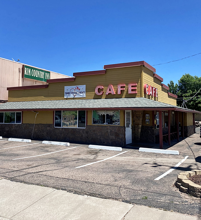 The iconic yellow exterior of Beeline Cafe stands like a beacon of breakfast hope on Payson's main drag, promising comfort food salvation to hungry travelers.