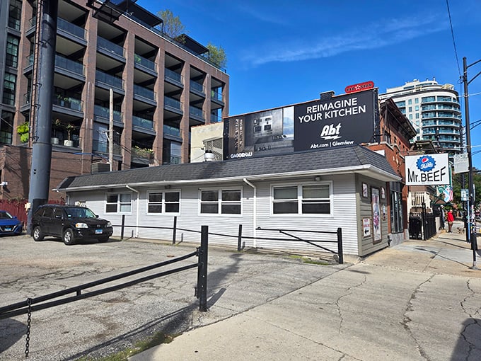 The unassuming white building with the iconic blue sign stands like a culinary lighthouse in Chicago's urban landscape. Sandwich salvation awaits inside.