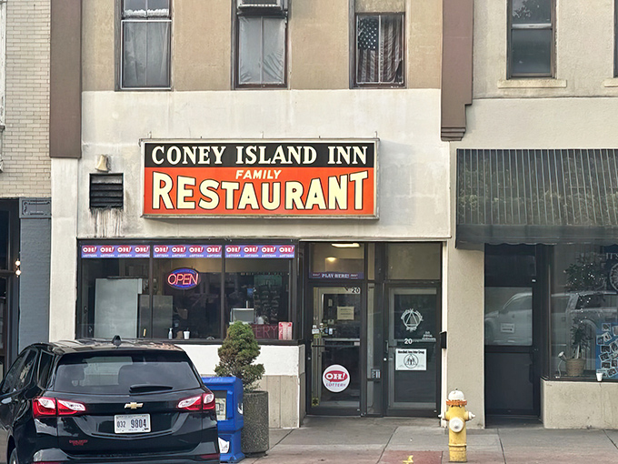 The vintage sign beckons like an old friend. Coney Island Inn's unassuming storefront hides culinary treasures that locals have cherished for generations.