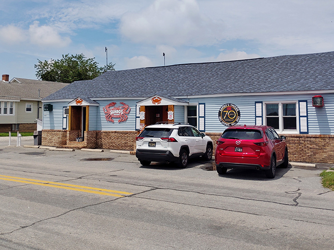 The iconic blue exterior with its bold red crab logo promises seafood treasures within &ndash; Delaware's ultimate "come as you are" dining destination.