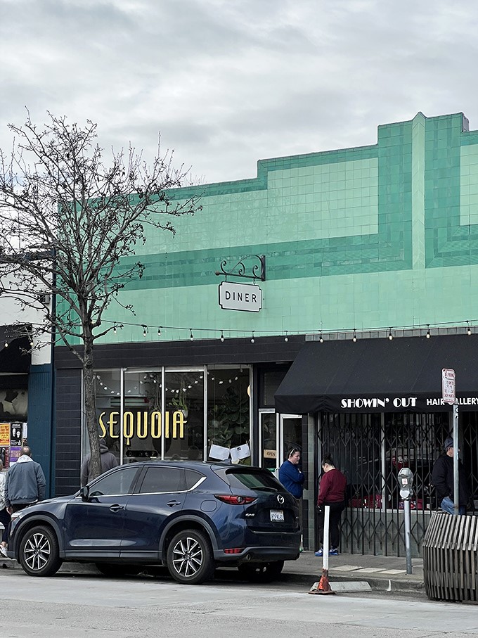 Art Deco meets morning magic – Sequoia Diner's mint-green facade stands proudly on Oakland's MacArthur Boulevard, promising breakfast revelations within those tiled walls.