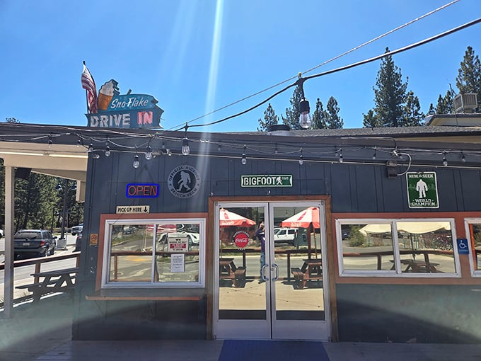 The neon glow of Sno-Flake Drive-In beckons like a lighthouse for hungry travelers. This humble roadside haven has been satisfying Tahoe cravings long before "foodie" was even a word.