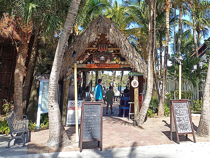 The entrance says it all &ndash; palm fronds, weathered wood, and that iconic sign promising the kind of Florida experience you can't manufacture in a boardroom.