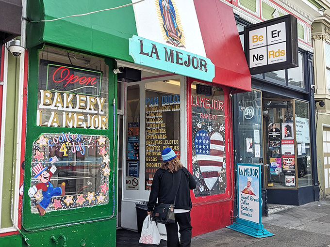 The vibrant red, white, and green fa&ccedil;ade of La Mejor Bakery stands as a colorful beacon of authentic Mexican pastries in San Francisco's Mission District.