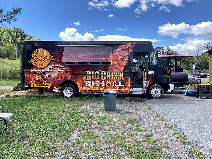 The flame-wrapped food truck announces its presence like a barbecue beacon. No fancy frills needed when the food does all the talking.