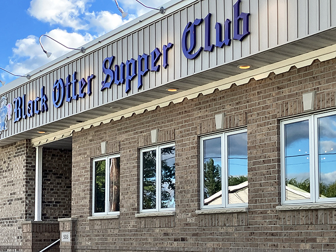 The iconic turret of Black Otter Supper Club stands sentinel over the parking lot&mdash;architectural proof that good taste extends beyond the kitchen.