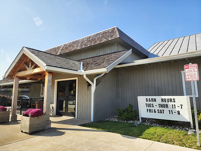 The charming white exterior of The Barn Restaurant's gift shop welcomes visitors with brick pathways and colorful flower beds&mdash;a prelude to the comfort food paradise within.