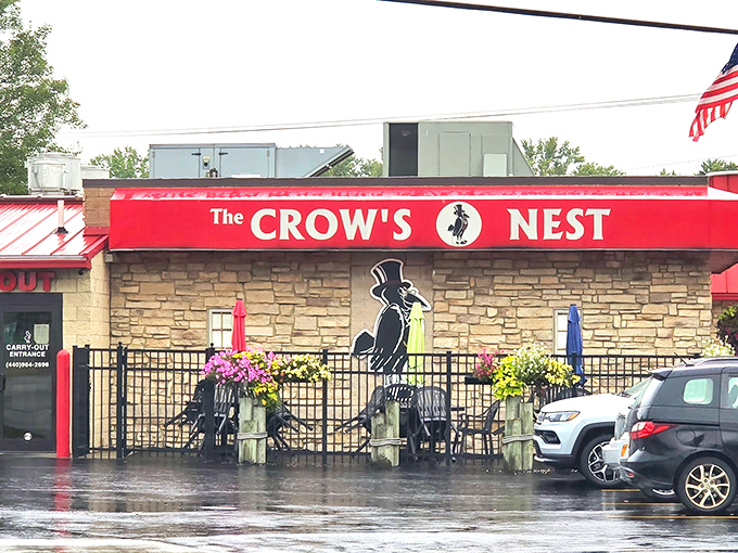 The bright red awning of The Crow's Nest stands out like a culinary lighthouse on Ashtabula's landscape, beckoning hungry travelers with promises of Italian-American comfort.