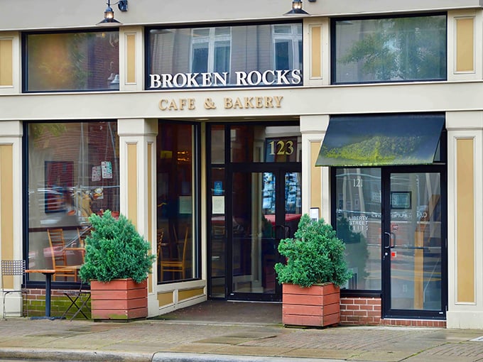 The charming brick façade of Broken Rocks beckons from downtown Wooster, promising culinary delights behind those elegant black awnings.