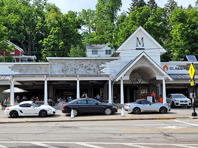 The charming white clapboard exterior of M Italian stands like a culinary lighthouse in Chagrin Falls, beckoning hungry travelers with its distinctive peaked roof.