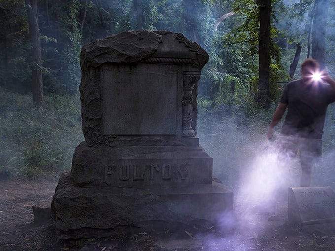 The Fulton gravestone stands sentinel in the misty woods, a weathered monument that seems to whisper stories from another time.