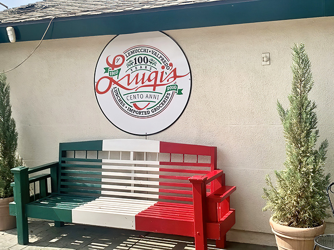 That Italian flag bench outside Luigi's practically begs you to sit and contemplate your impending food coma.