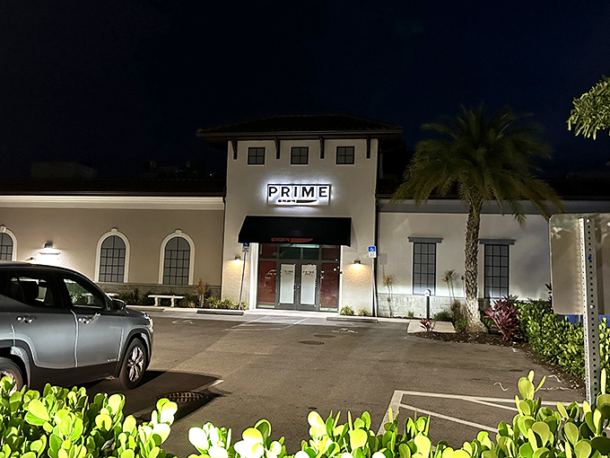 The Mediterranean-inspired exterior of PRIME stands proudly against Florida's blue sky, its red-tiled roof and cream walls promising culinary adventures within.