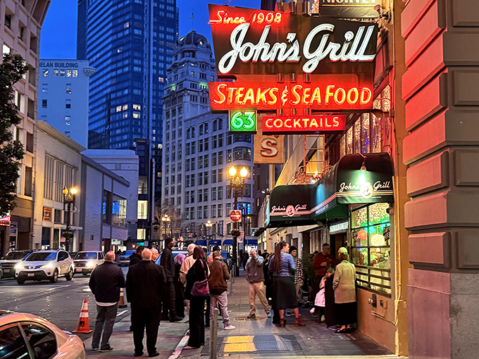The iconic green and gold signage of John's Grill stands as a beacon of culinary history on Ellis Street, promising steaks, seafood, and stories since 1908.
