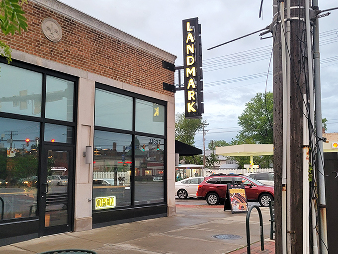 That vintage "LANDMARK" sign beckoning from the street corner promises serious barbecue business awaits inside.