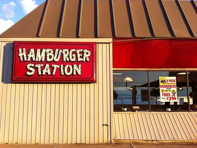 The iconic red sign beckons like a lighthouse for hungry travelers. Simplicity in architecture that promises complexity in flavor.